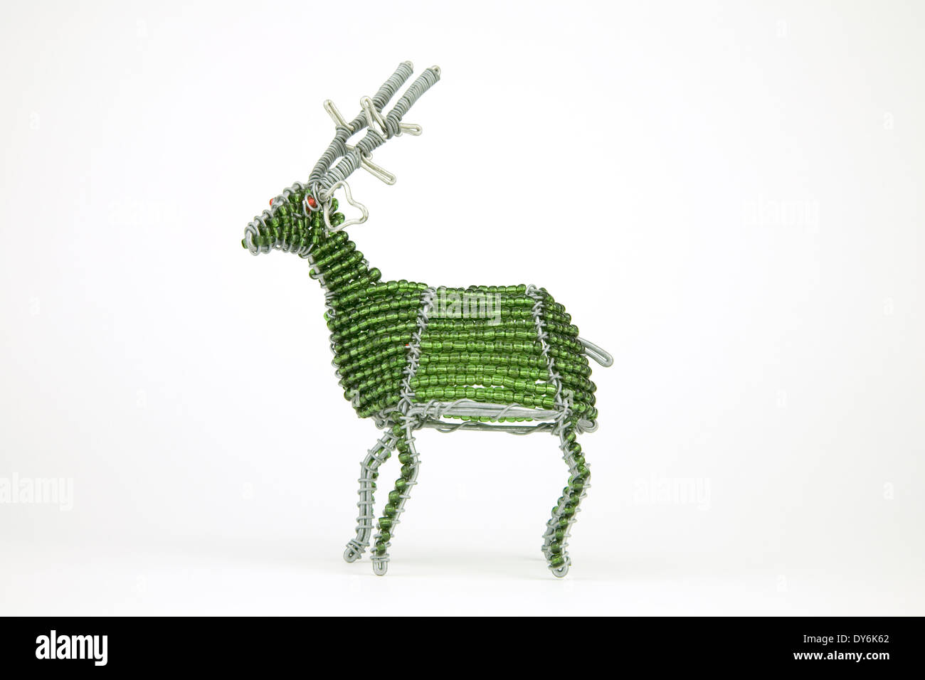 Wired and beaded African animal Craft of a Buck isolated on a white ...
