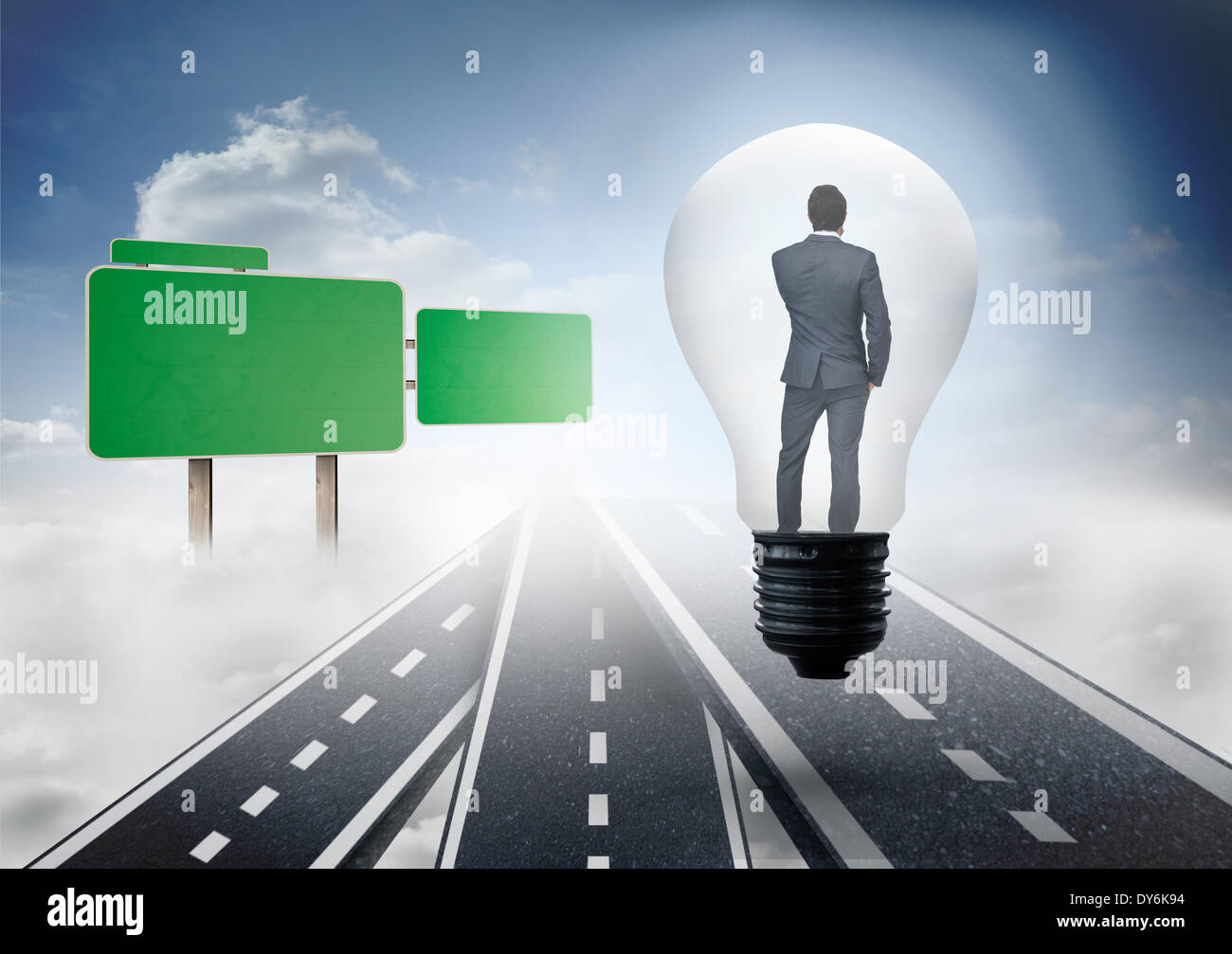 Thinking businessman in light bulb against doors revealing bright light ...