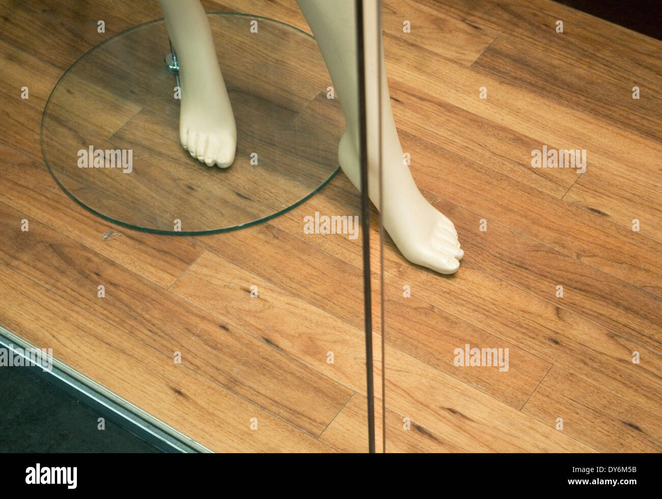 mannequin feet in window display Stock Photo - Alamy