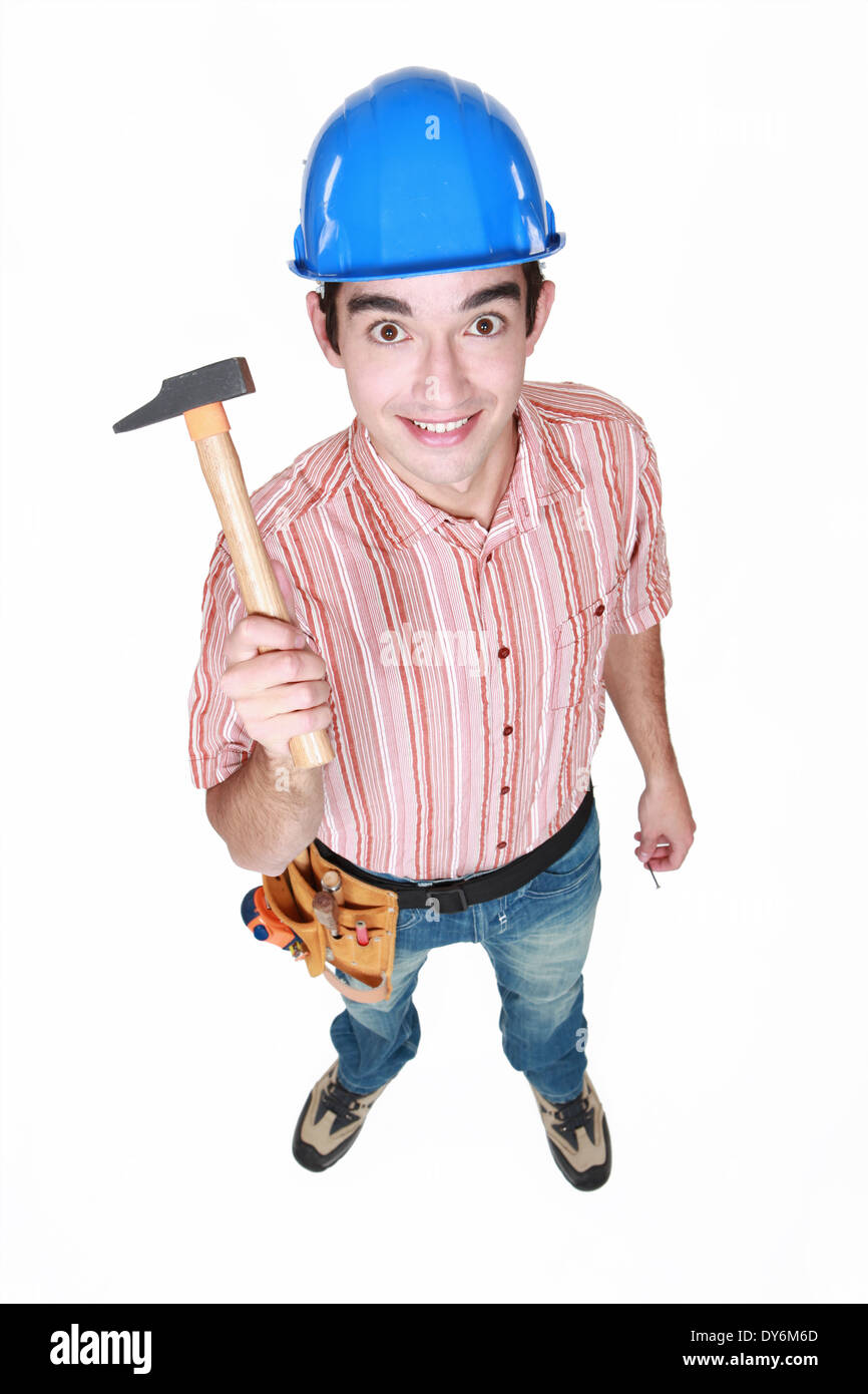 Happy worker holding hammer Stock Photo - Alamy