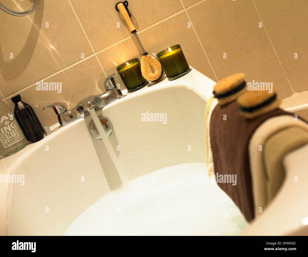 Bath and running tap Stock Photo - Alamy