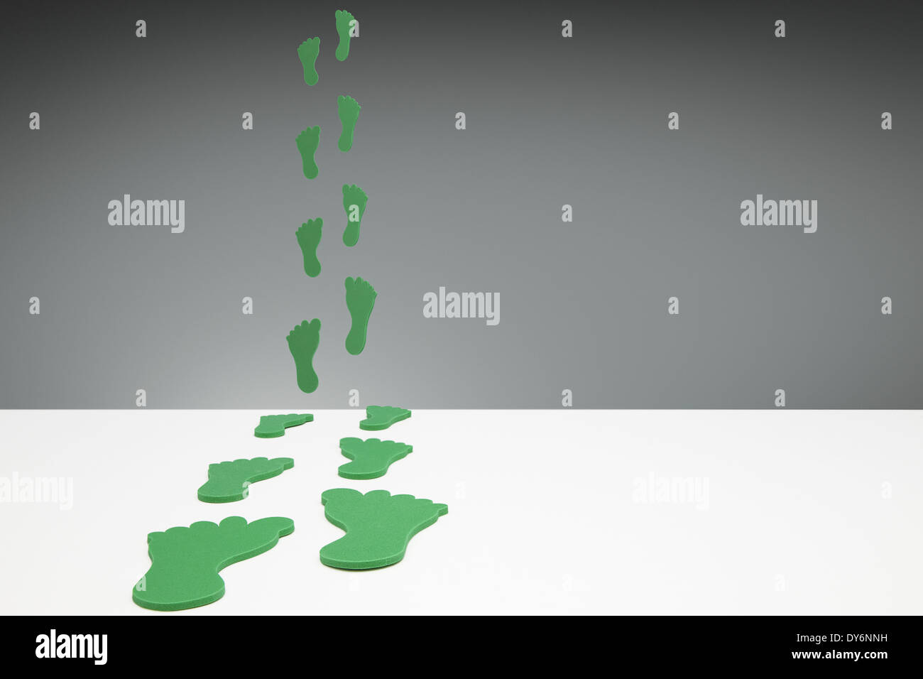 Green footprints hi-res stock photography and images - Alamy