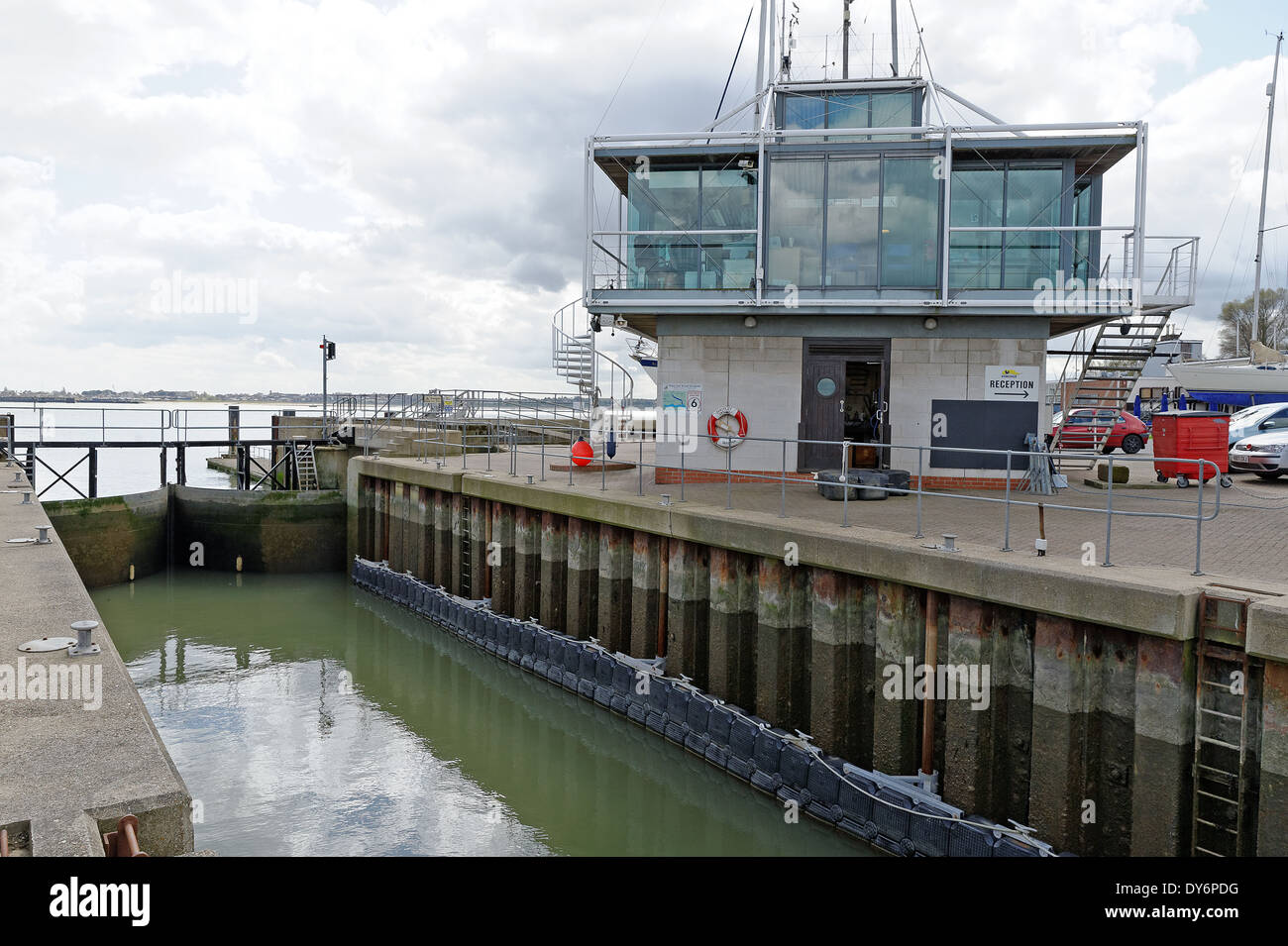 The entrance lock to Shotley Marina,Suffolk,UK, with control tower on ...