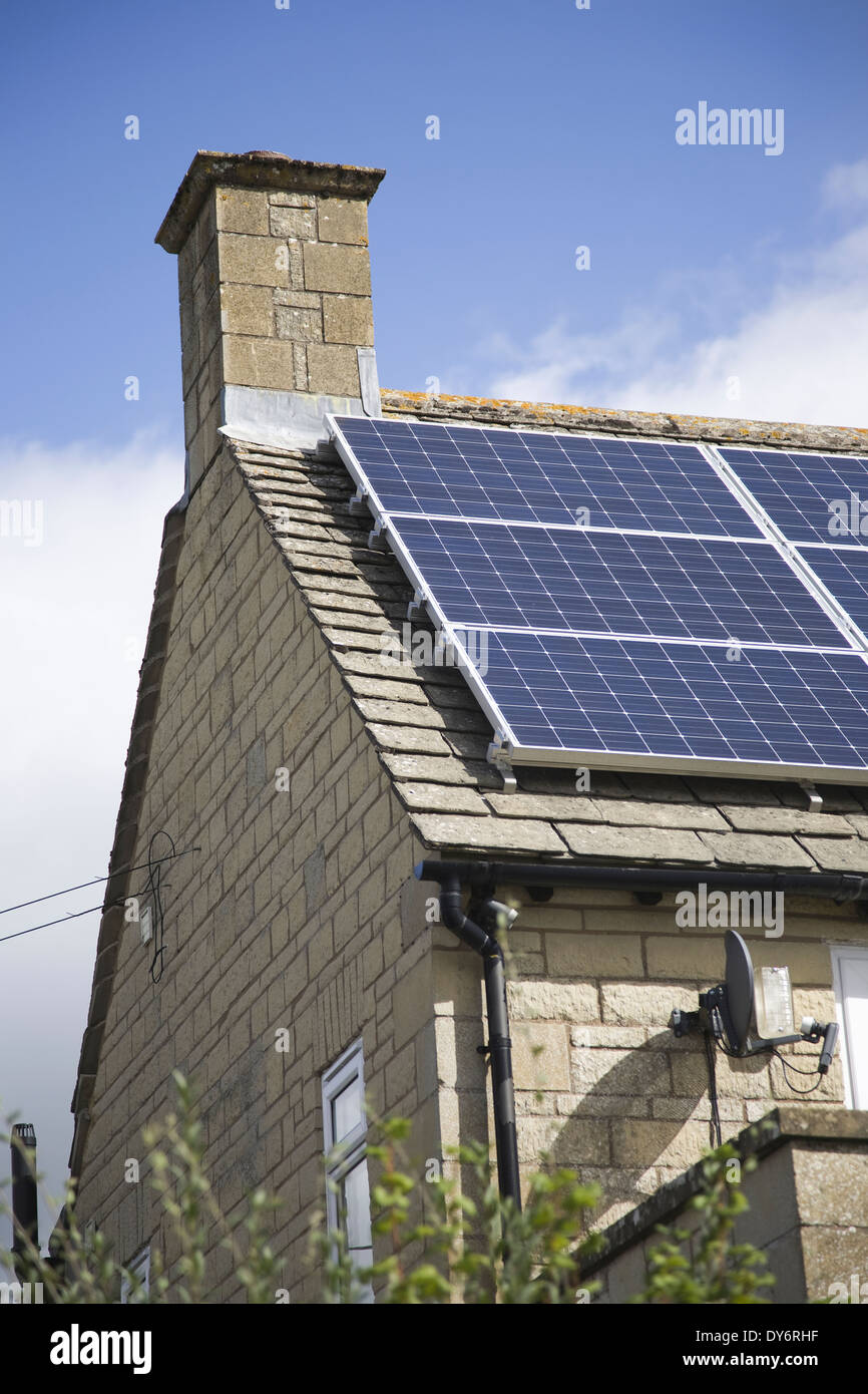 Solar Panels on a house roof Stock Photo - Alamy