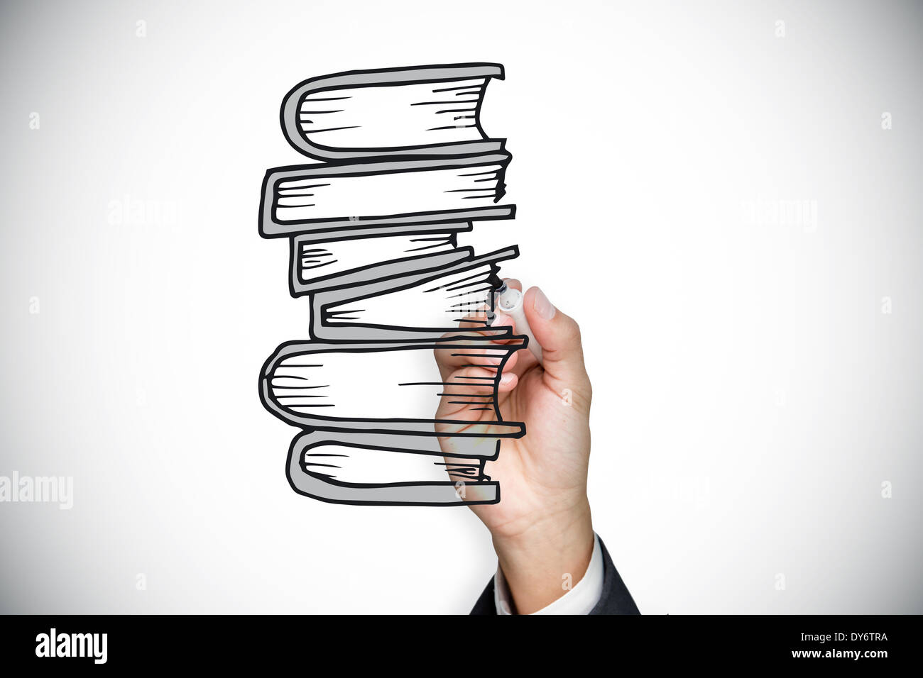 Composite image of businessman drawing books against green vignette ...