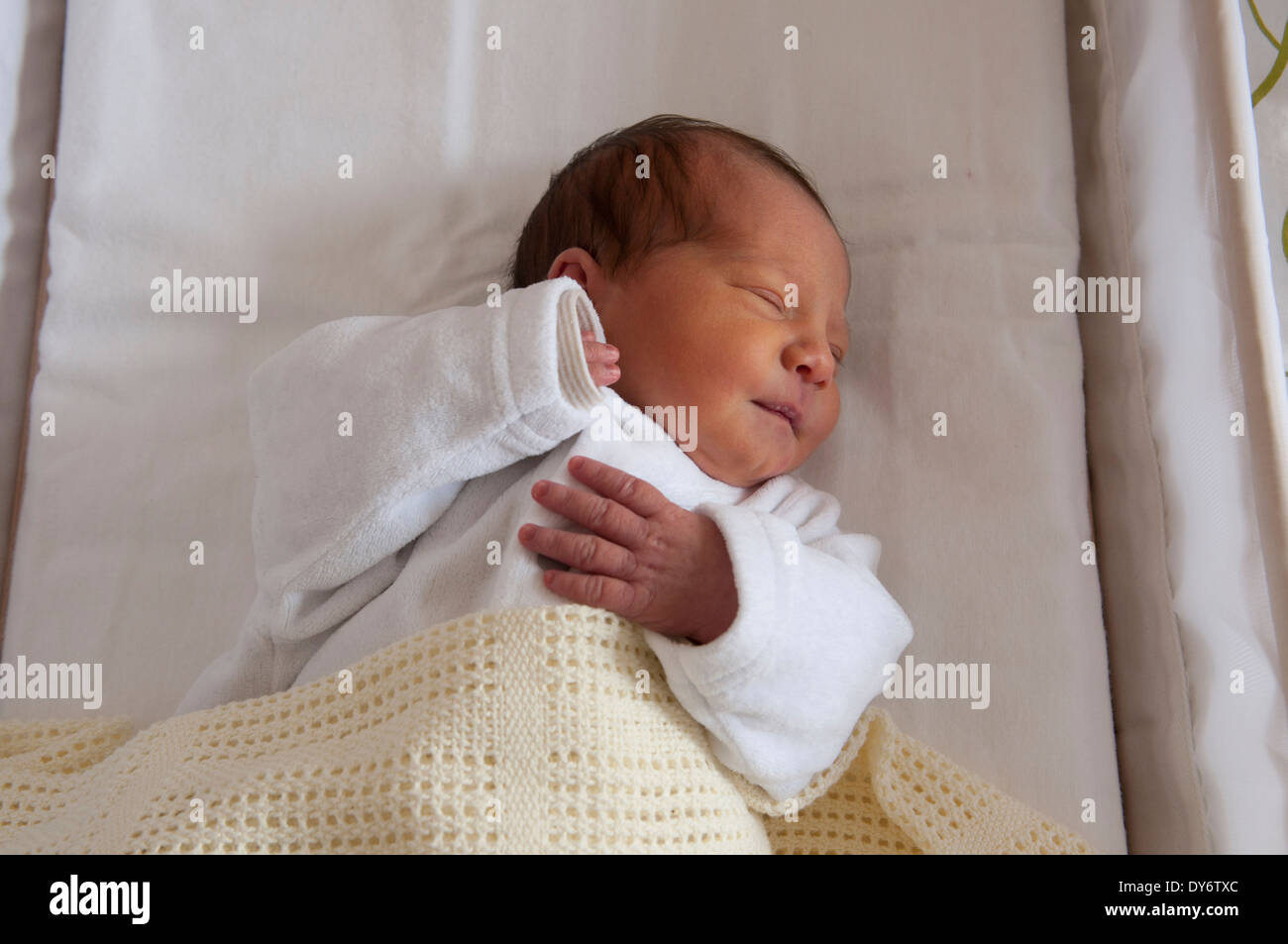 Three day old newborn baby girl asleep in her crib Stock Photo - Alamy