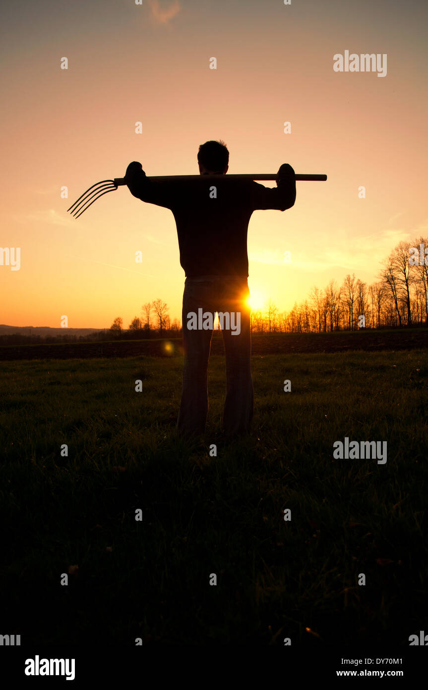 Man hay fork silhouette hi-res stock photography and images - Alamy