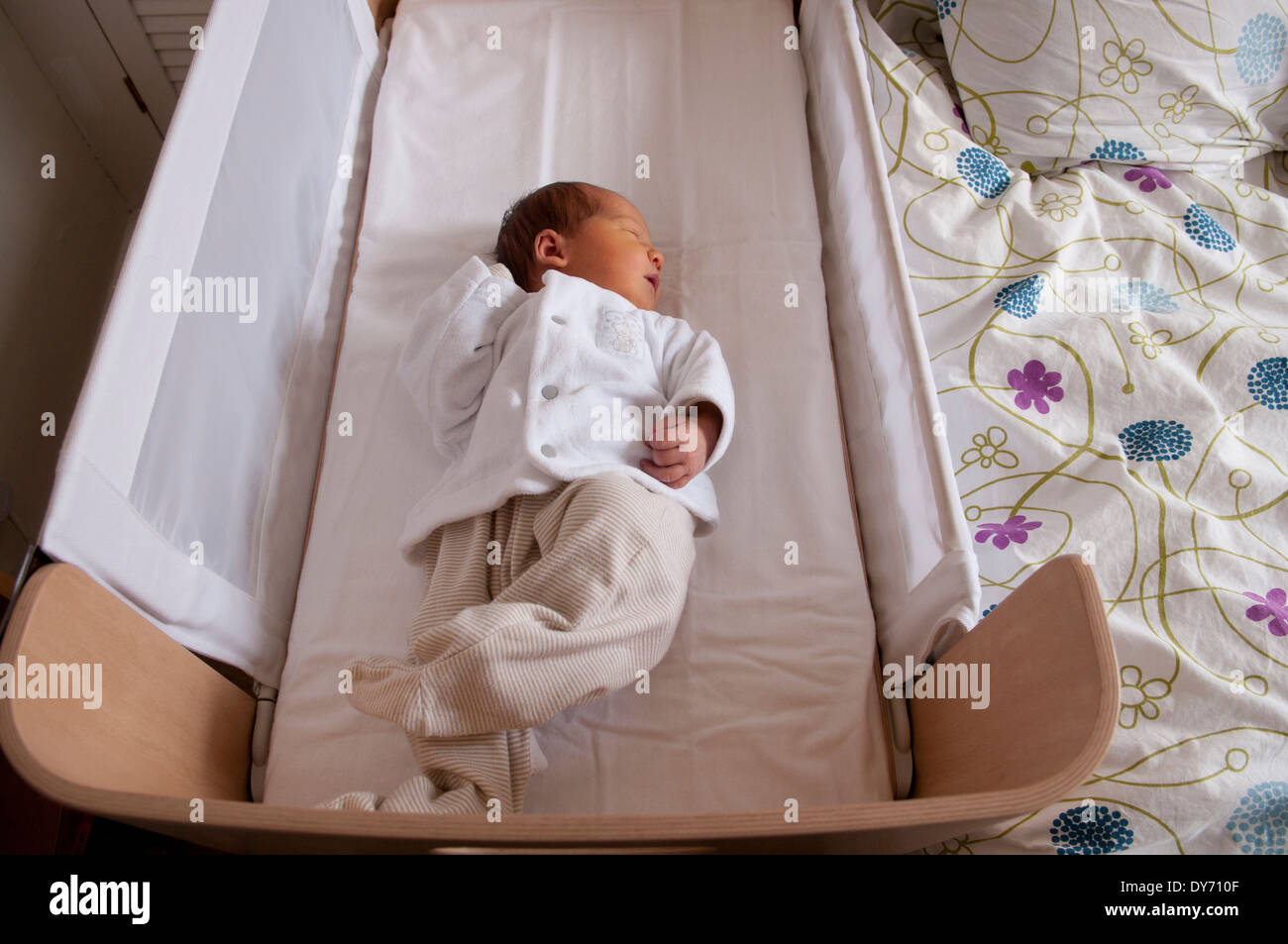Newborn Baby Girl Sleeping In Crib