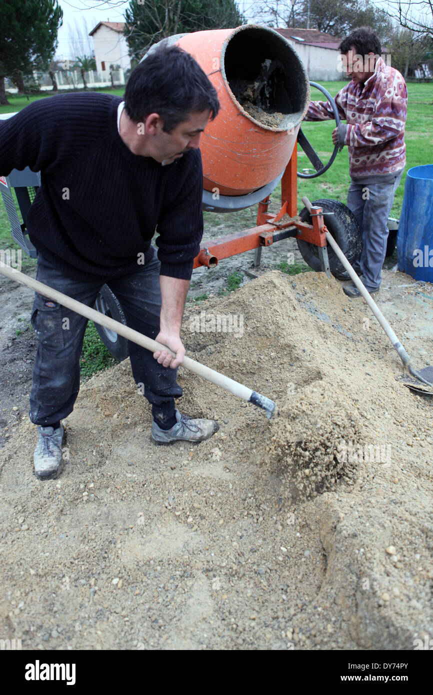 Men mixing cement Stock Photo - Alamy