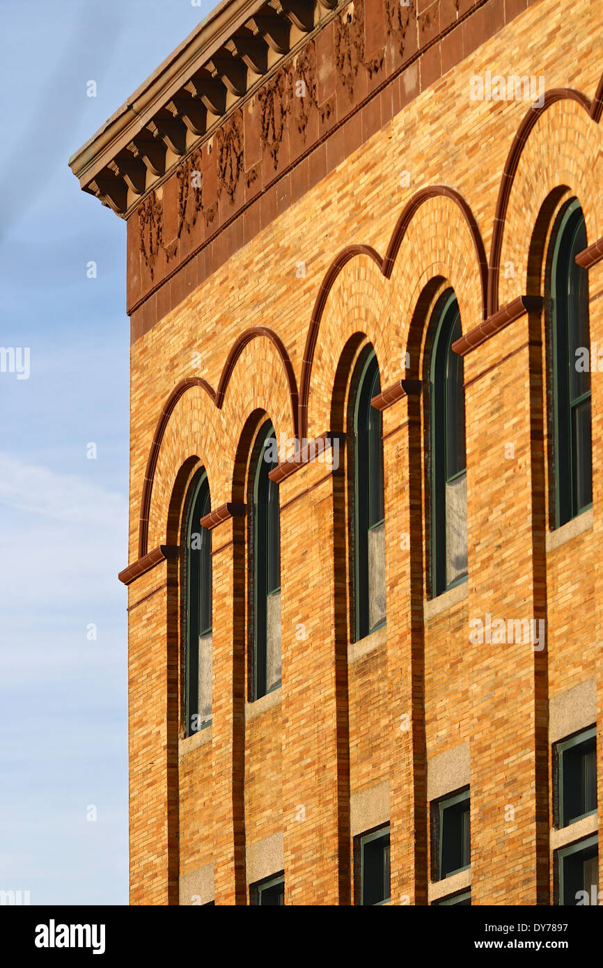 Tan Colored Brick Building with Arched Windows at Dawn Stock Photo - Alamy