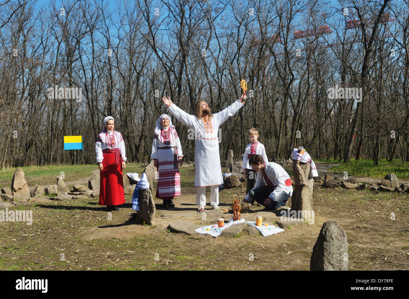 Pagan "Easter" in Ukraine. Priest and worshipers in traditional clothes ...