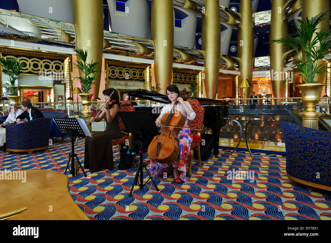 Musicians playing classical music to entertain clients at the Burj Al ...