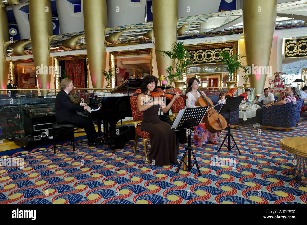 Musicians playing classical music to entertain clients at the Burj Al ...