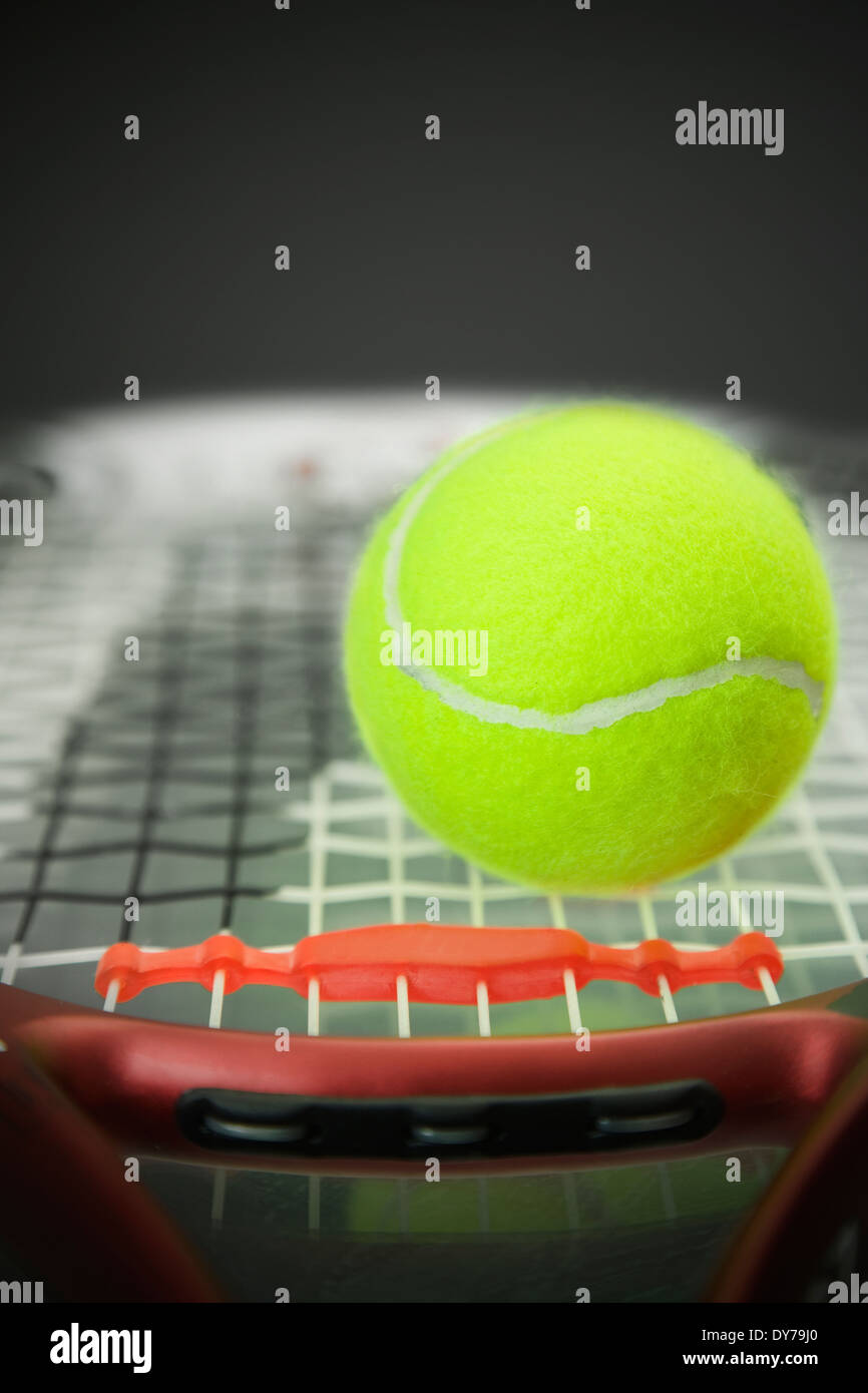 Tennis ball on a Carbon Graphite tennis racket Stock Photo - Alamy
