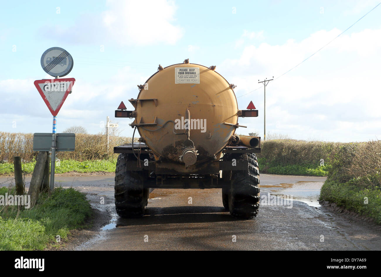 Agricultural sludge tanker filling a small rural road, April 2014 Stock ...