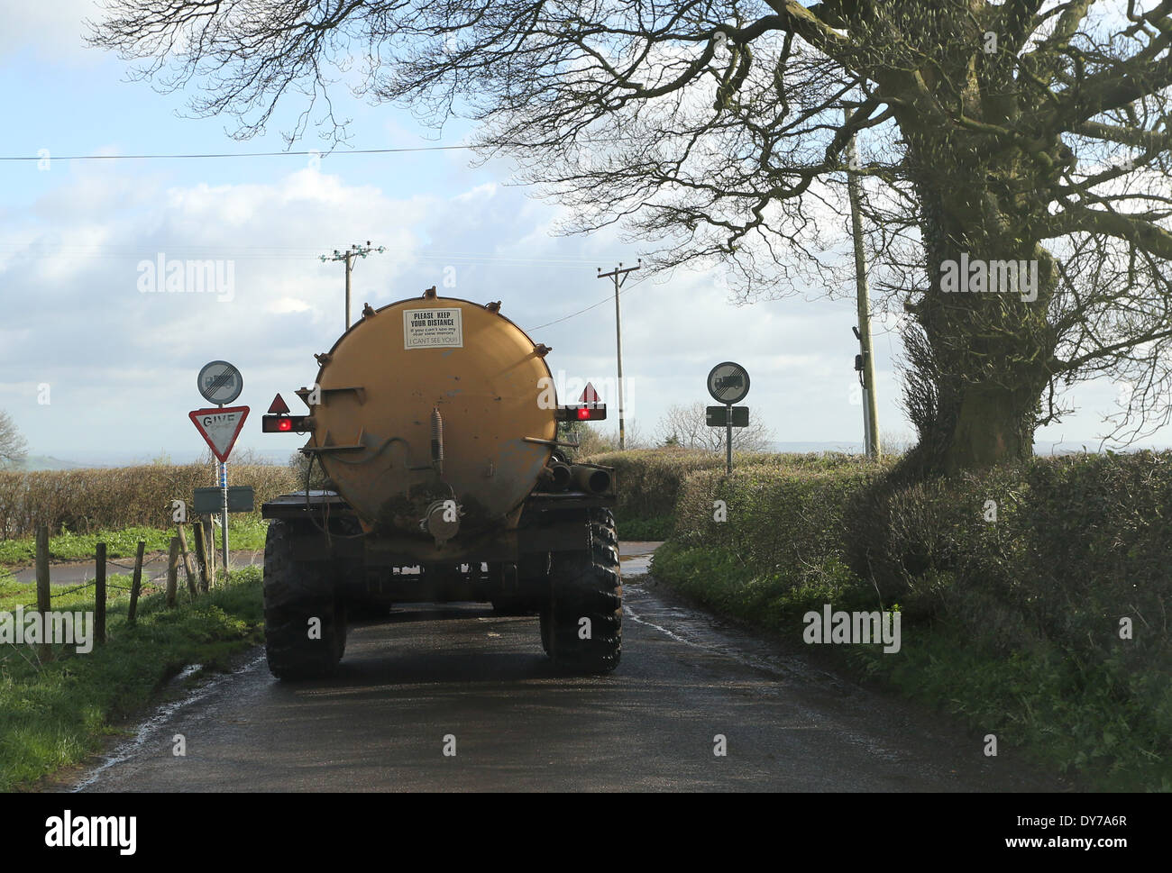 Agricultural sludge tanker filling a small rural road, April 2014 Stock ...