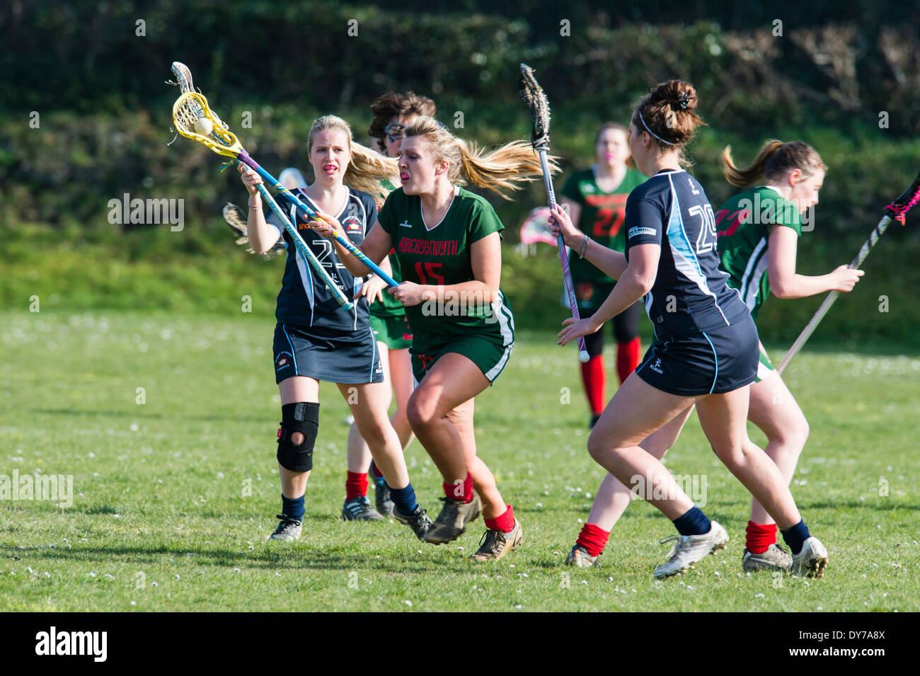 Aberystwyth university women's team (in green) playing lacrosse against ...