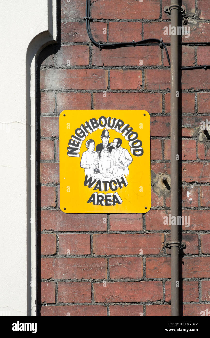 Neighbourhood watch area sign on a brick wall Stock Photo - Alamy