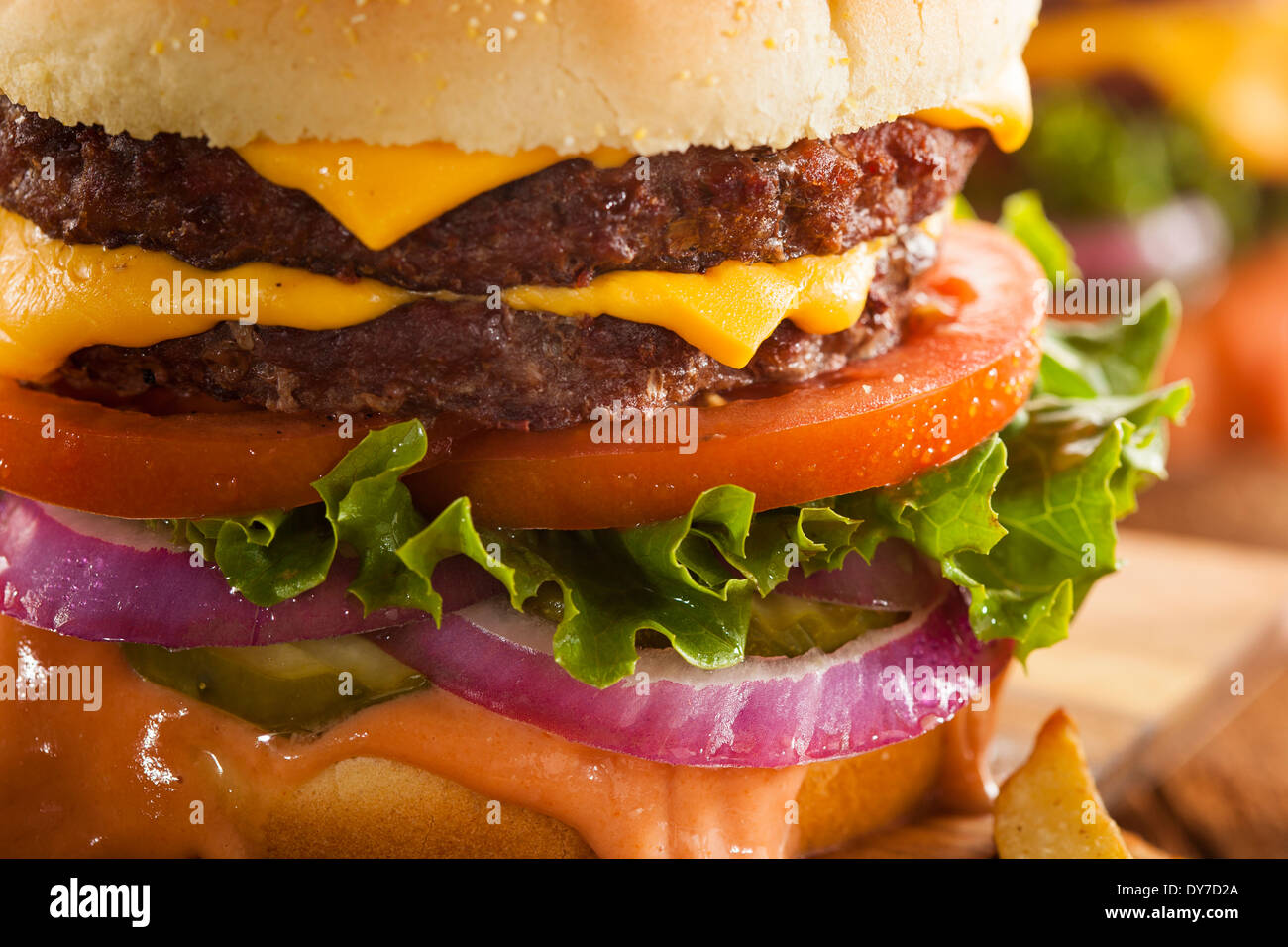 Beef Cheese Hamburger with Lettuce Tomato and Onions Stock Photo - Alamy