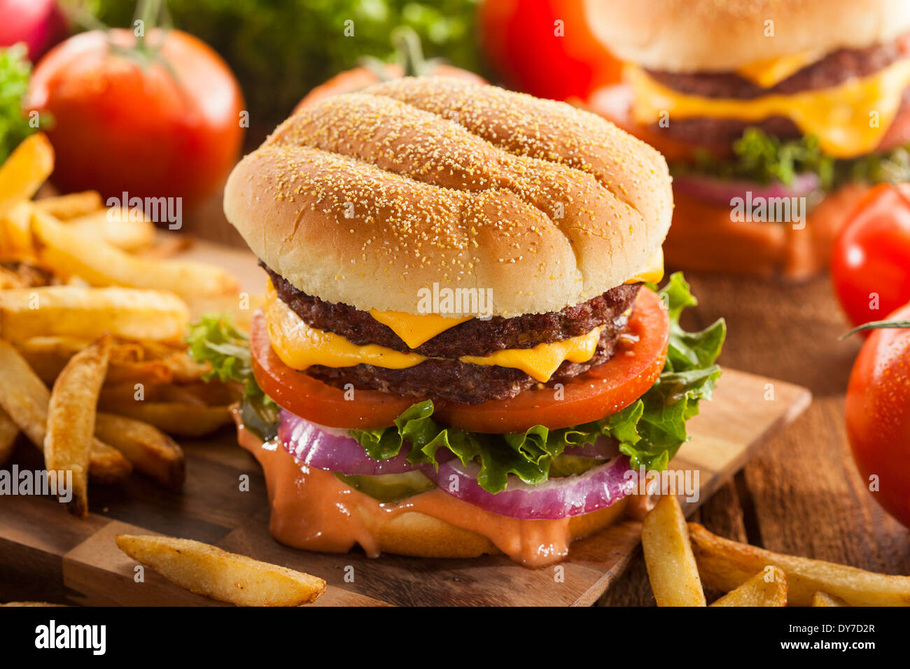 Beef Cheese Hamburger with Lettuce Tomato and Onions Stock Photo - Alamy