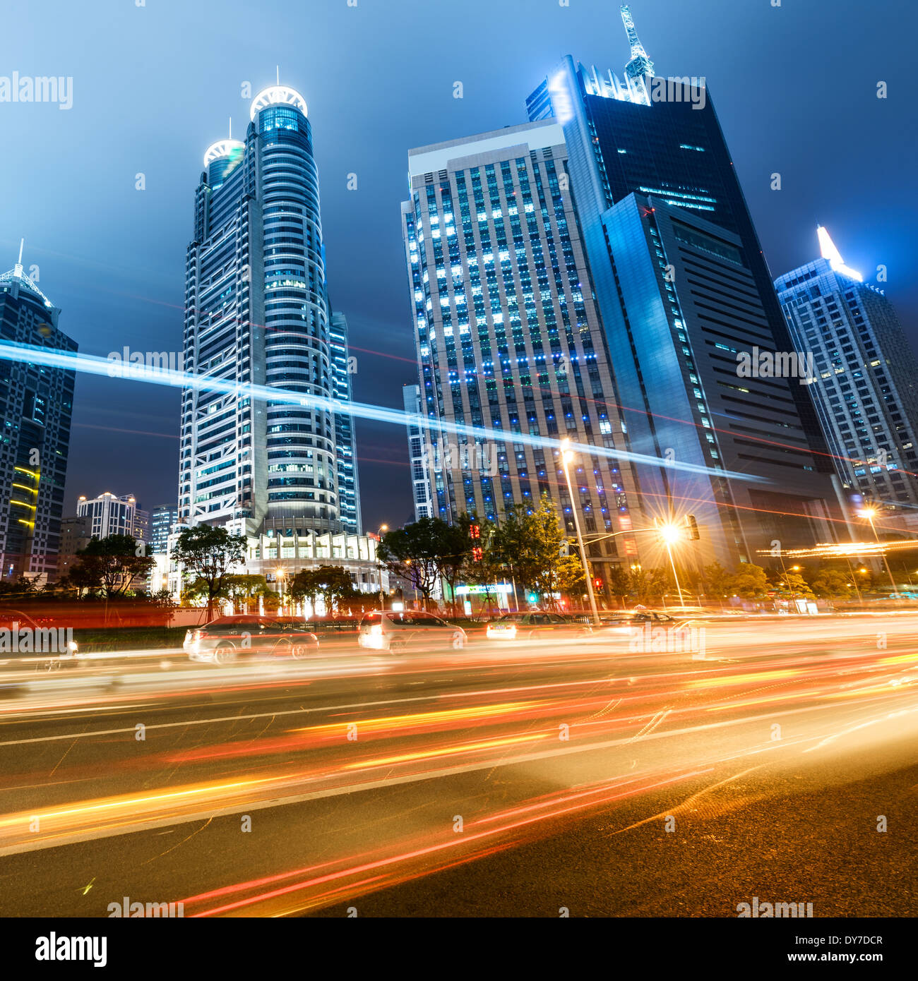 the light trails on the modern building background in shanghai china ...