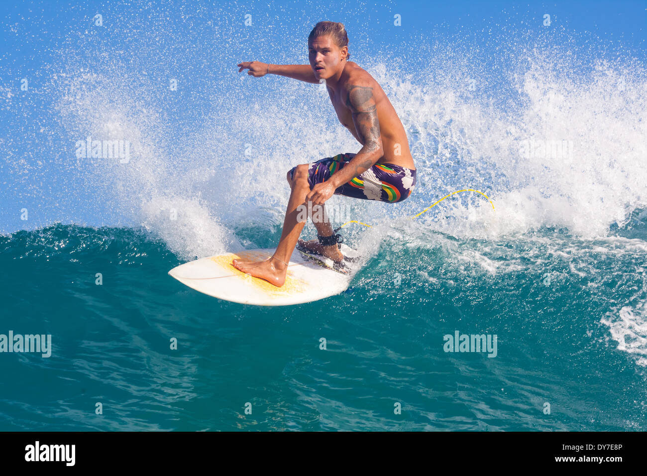 Surfing a wave. GLand surf area.Java island.Indonesia Stock Photo - Alamy