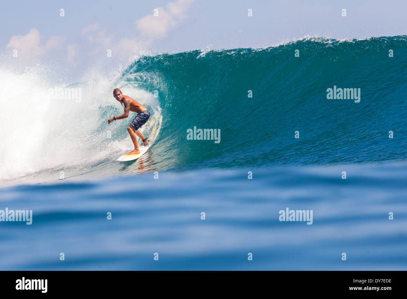 Surfing a wave. GLand surf area.Java island.Indonesia Stock Photo - Alamy