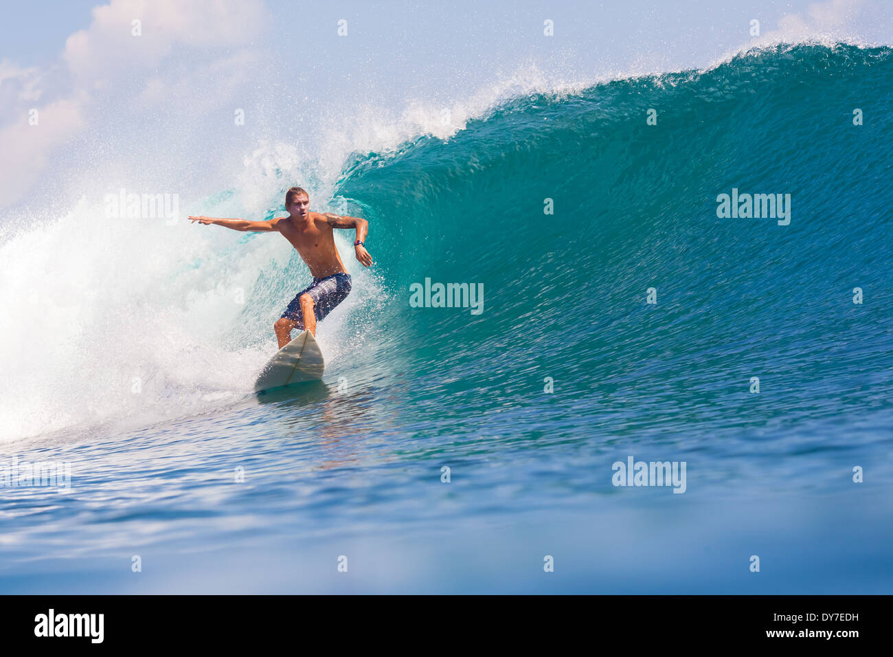 Surfing a wave. GLand surf area.Java island.Indonesia Stock Photo - Alamy