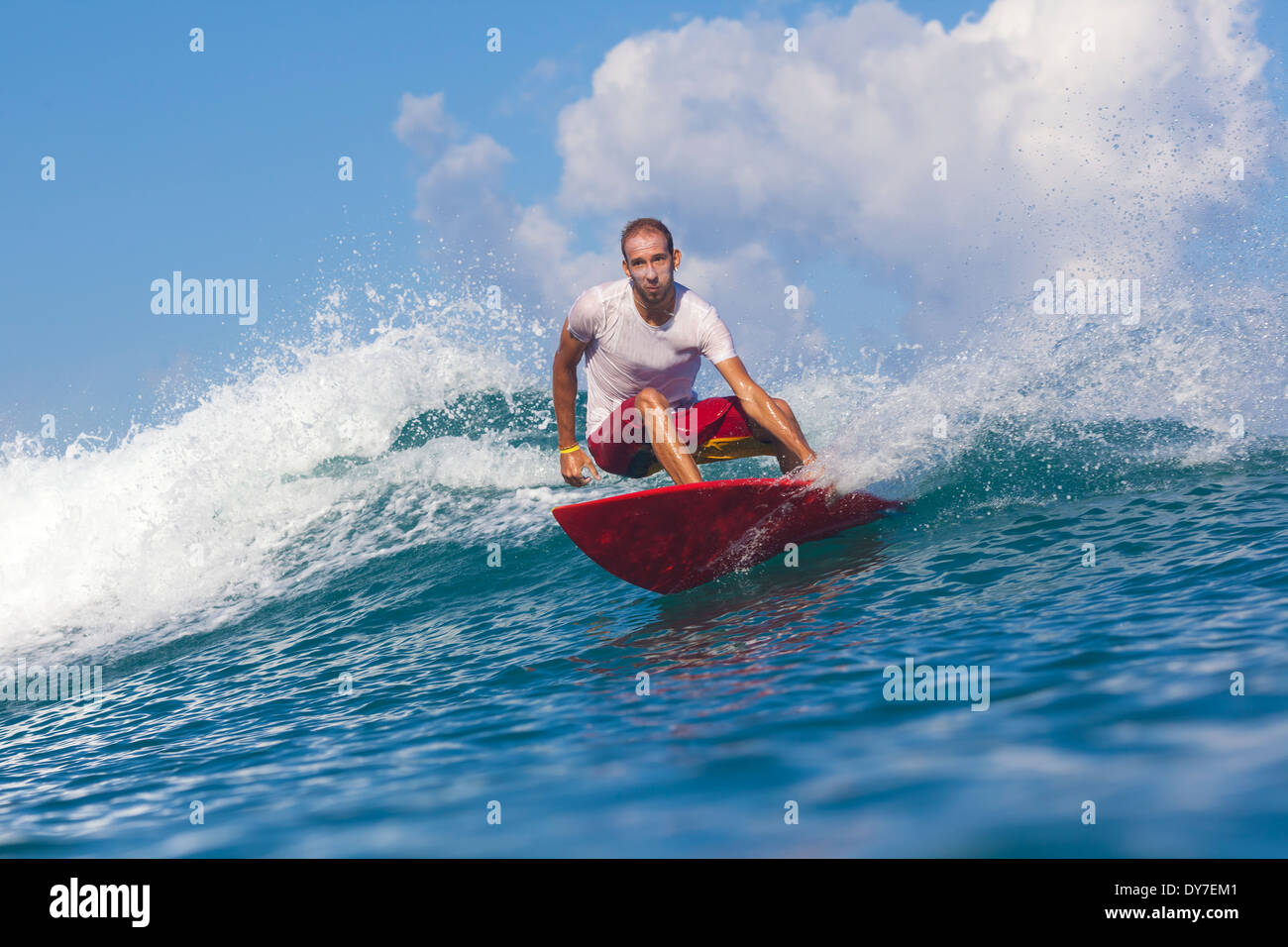 Surfing a wave in Indian ocean Stock Photo - Alamy