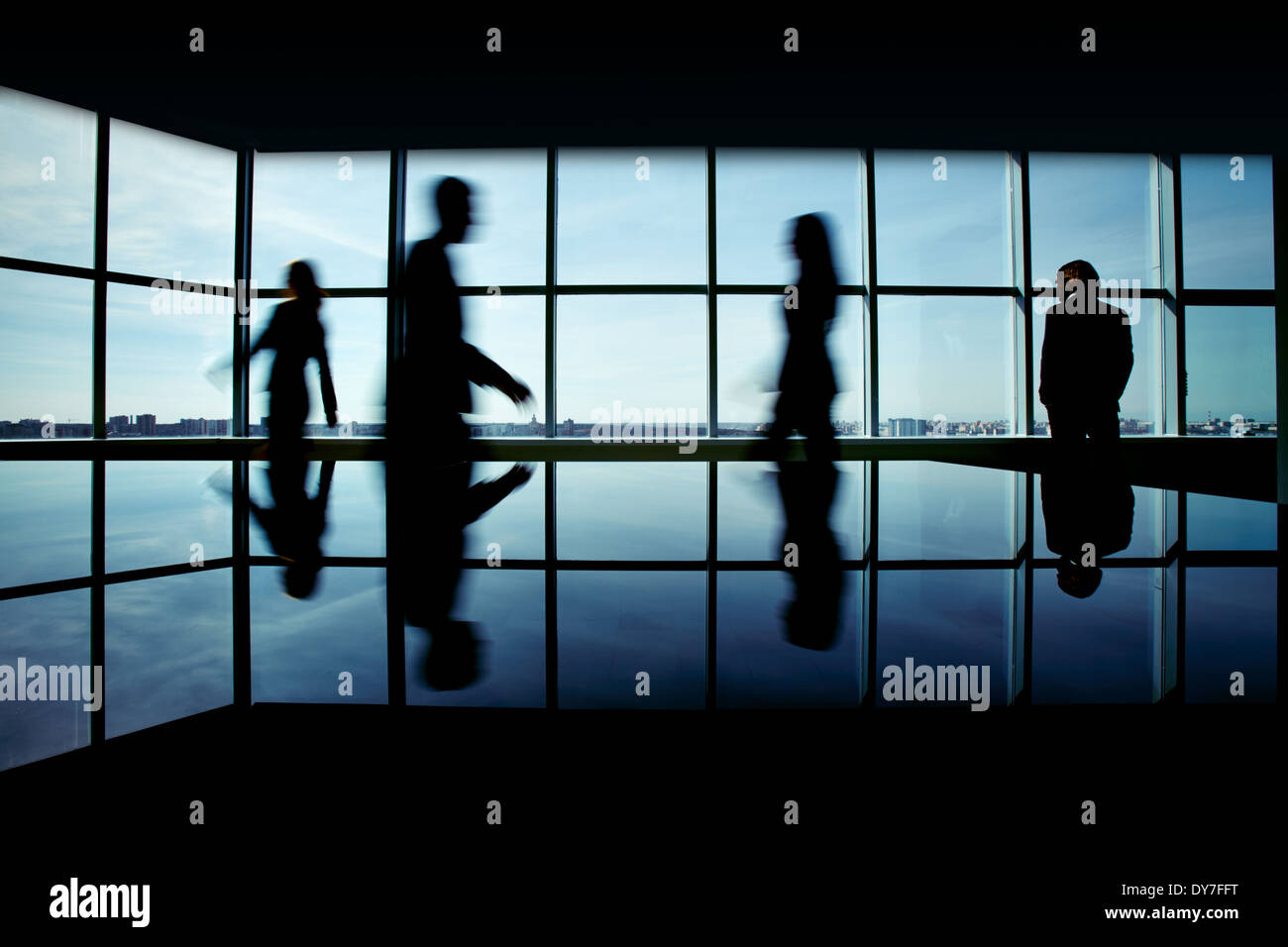 Silhouettes of several office workers on background of window Stock ...