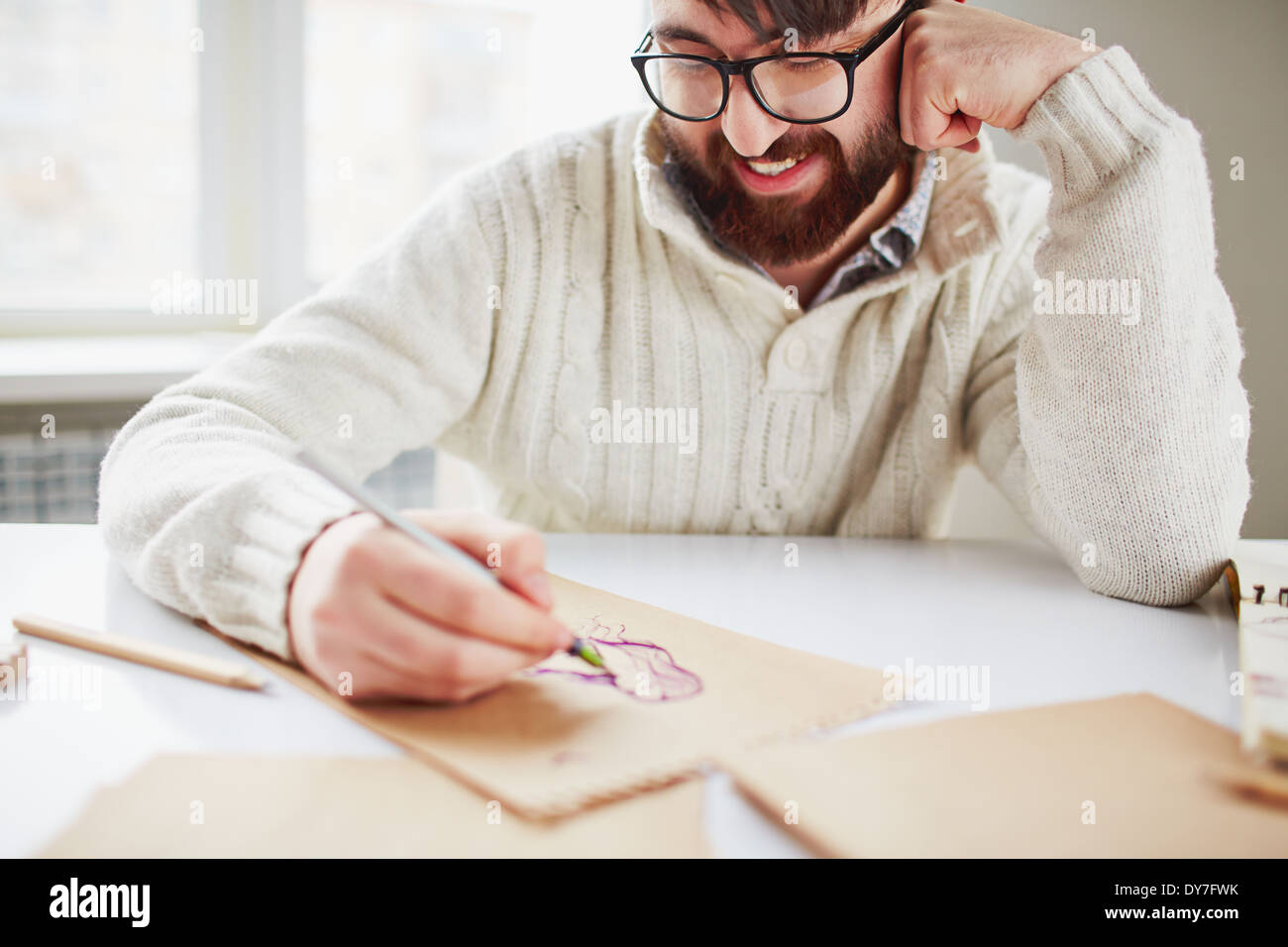 Image of happy young man drawing Stock Photo - Alamy