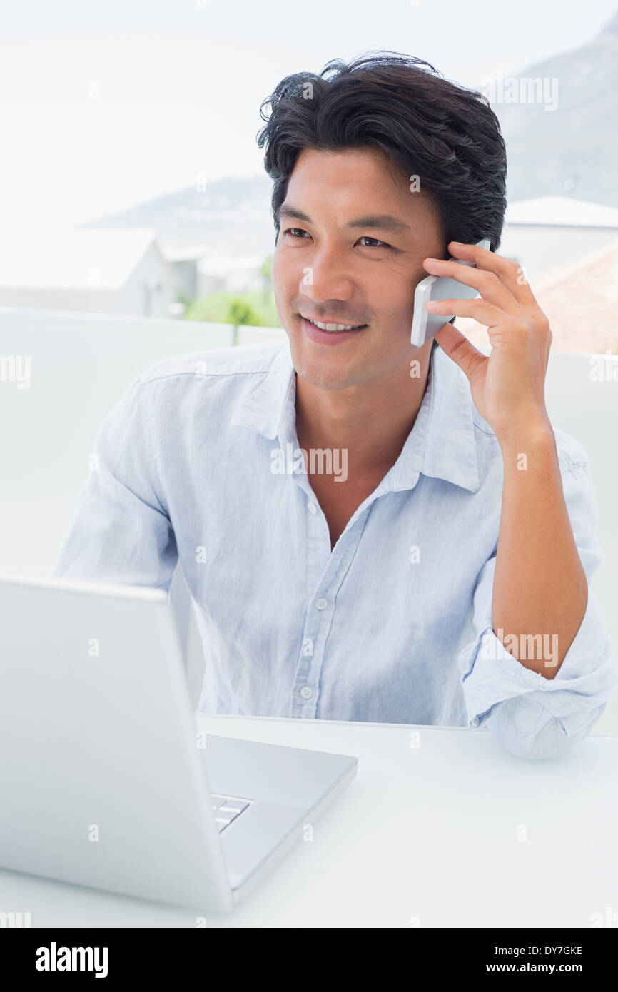 Man using mobile phone on balcony hi-res stock photography and images ...