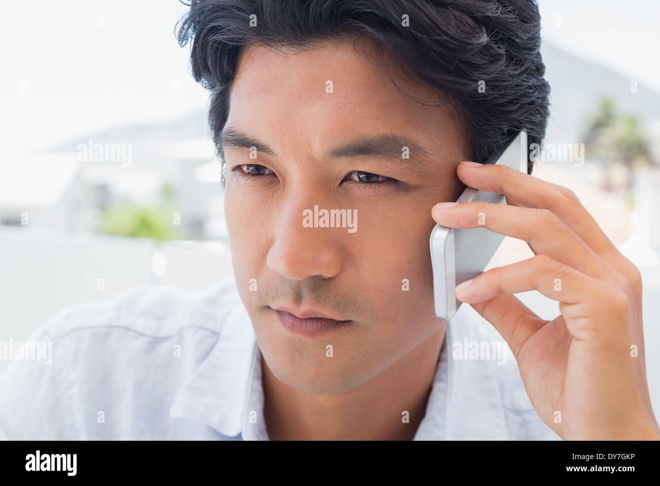 Serious asian man holding hi-res stock photography and images - Alamy