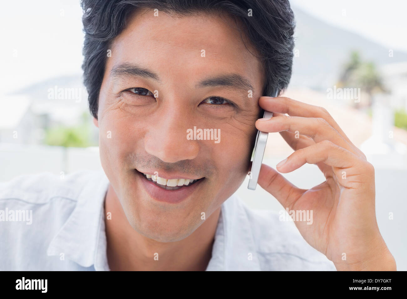 Smiling man on phone call Stock Photo - Alamy