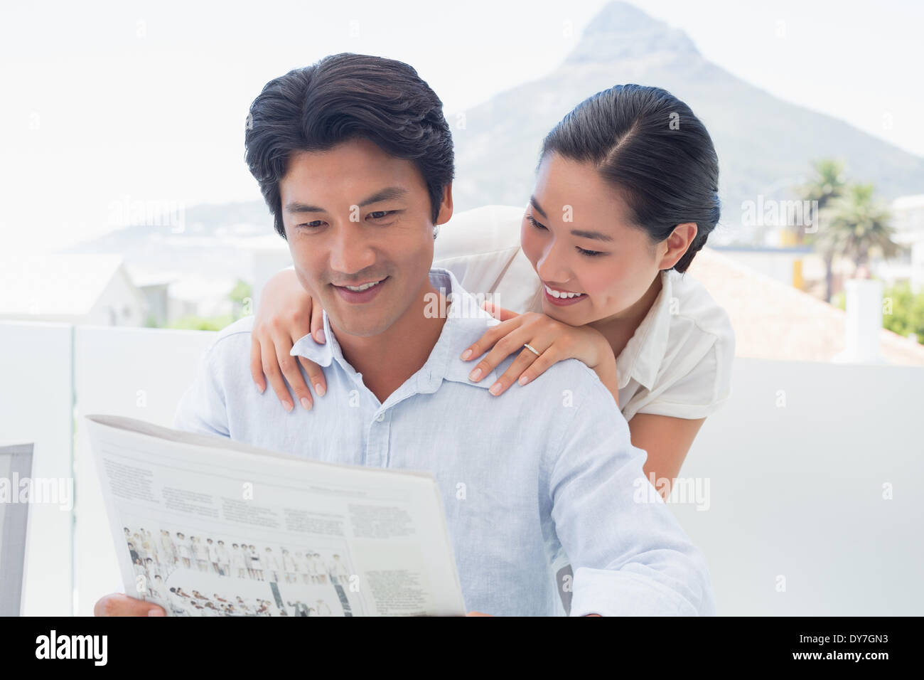 Couple home reading newspaper hi-res stock photography and images - Alamy