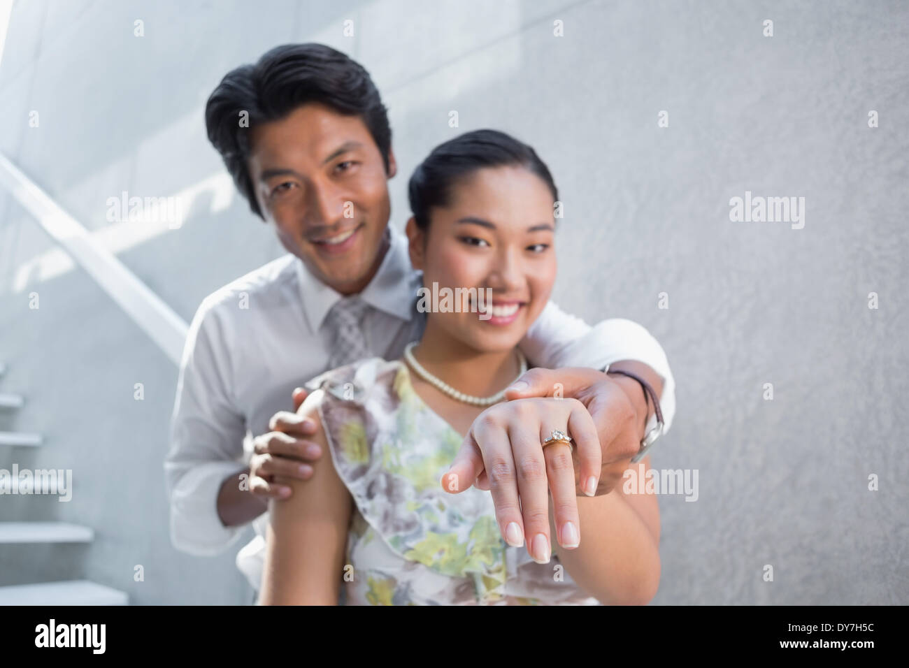 Couple showing engagement ring on womans finger Stock Photo - Alamy