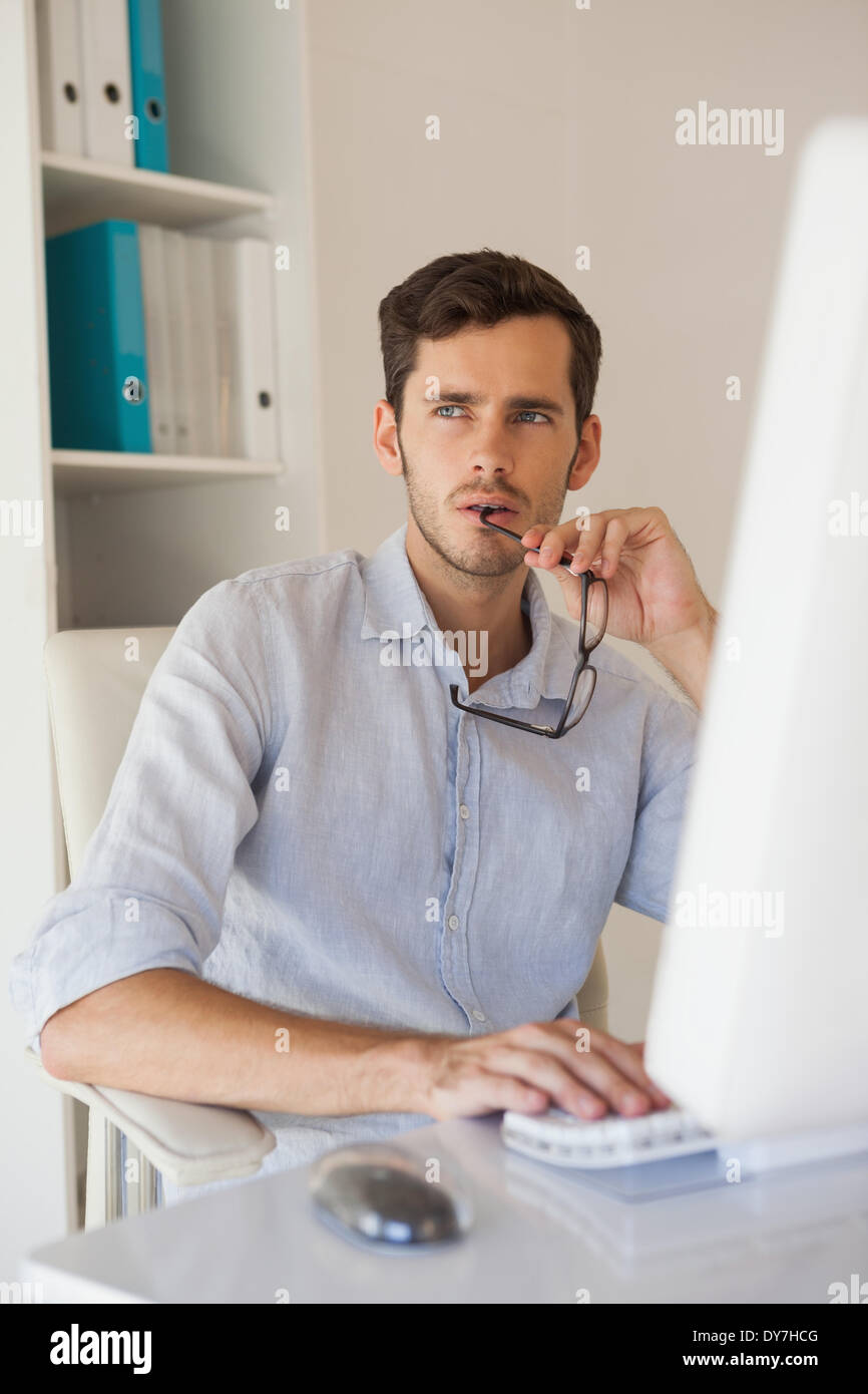 Thinking typing man desk hi-res stock photography and images - Alamy