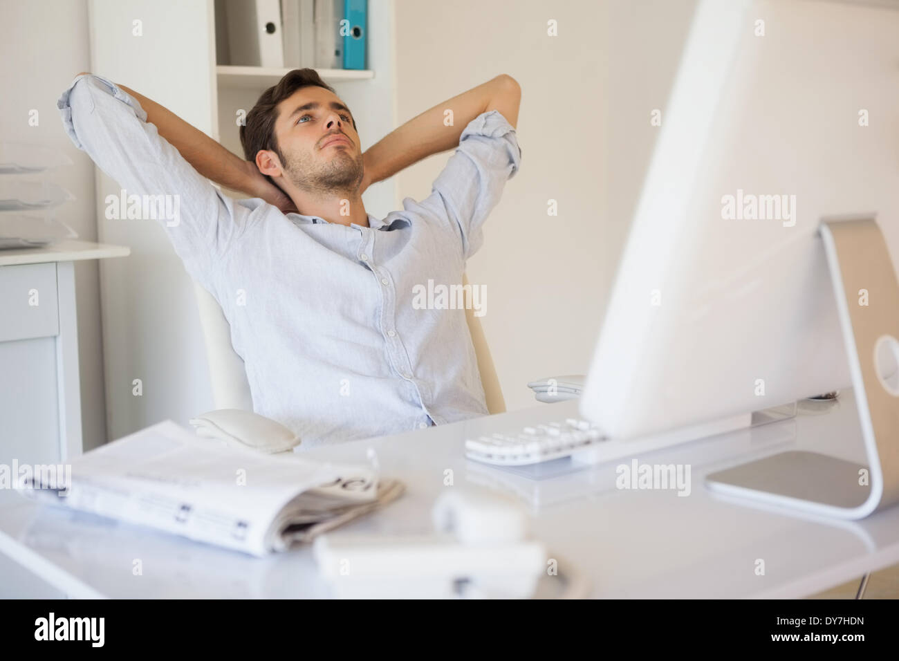 Man desk leaning back hands hi-res stock photography and images - Alamy