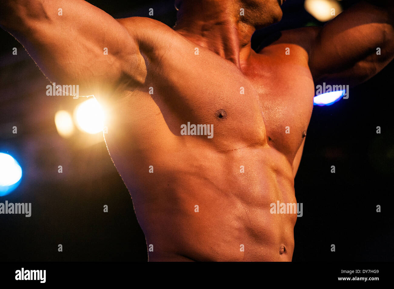 Detail of a male bodybuilder during the fitness fair FIBO in Cologne ...