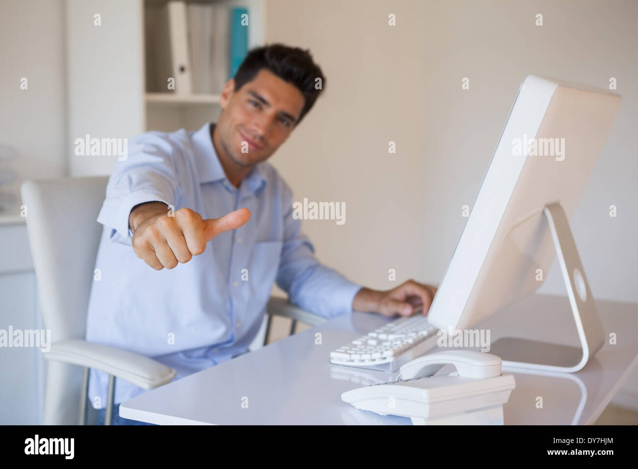 Businessman working computer thumbs up hi-res stock photography and ...