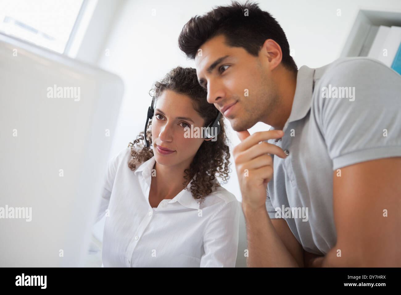 Businessman woman looking computer hi-res stock photography and images ...