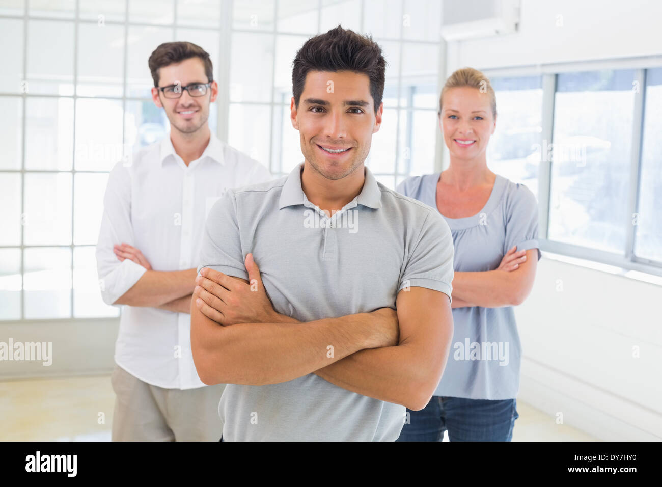Casual business team smiling at camera Stock Photo - Alamy