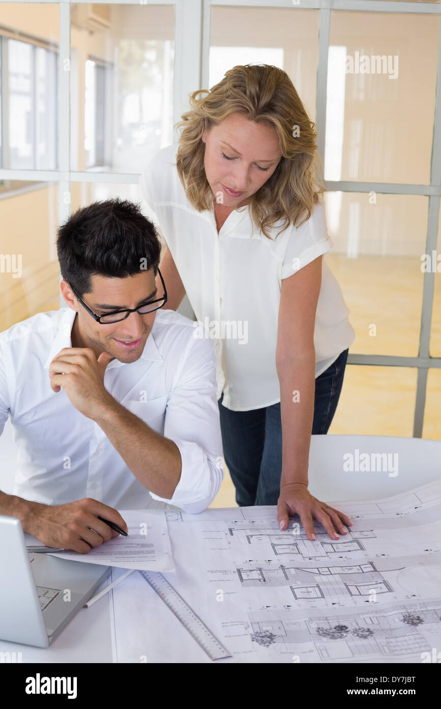 Architect team working blueprints laptop hi-res stock photography and ...