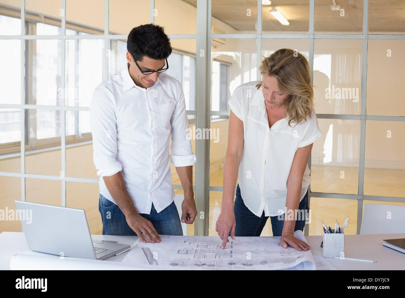Architect team working blueprints laptop hi-res stock photography and ...