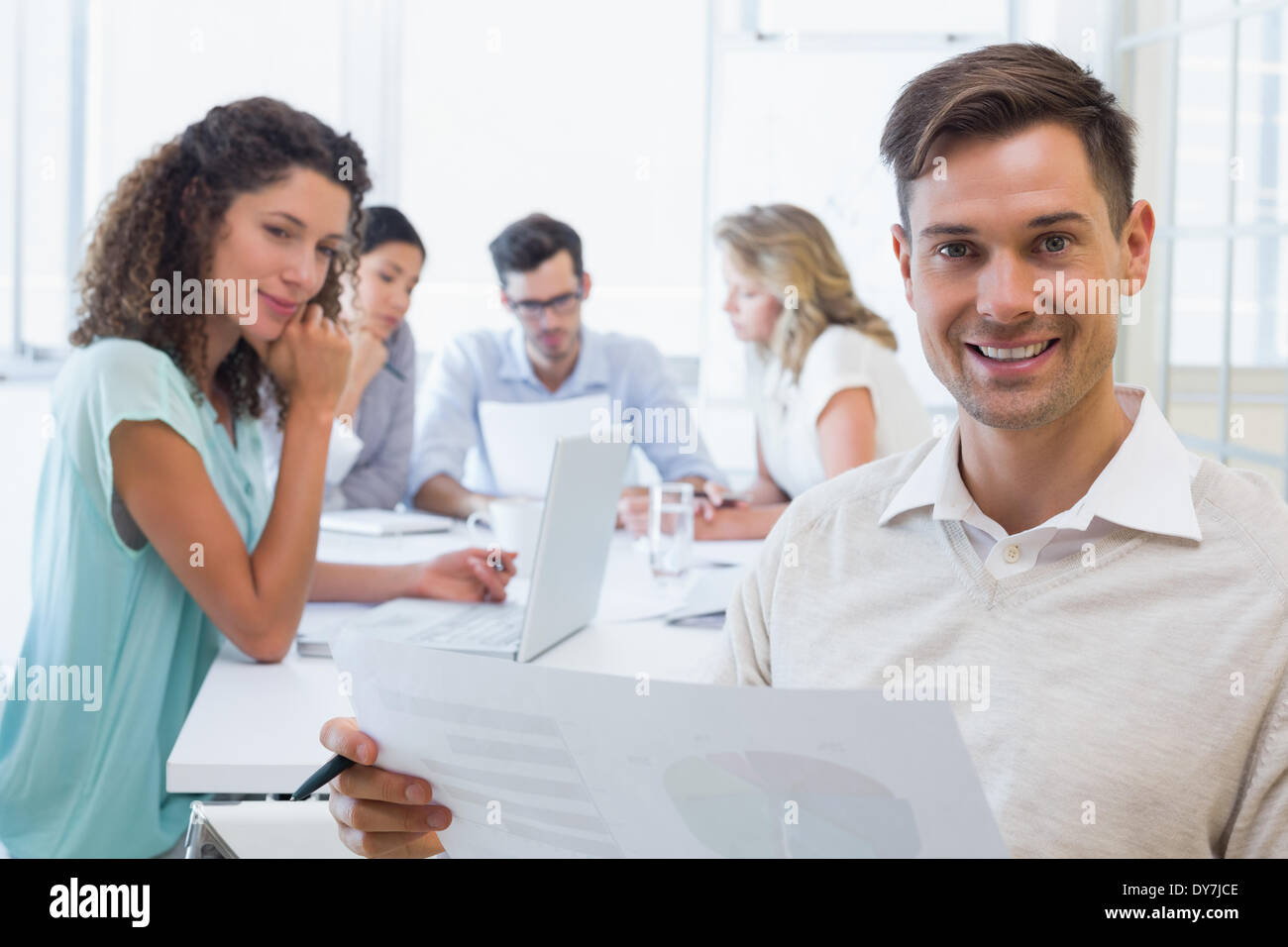 Casual businessman reading document during meeting in the office Stock ...