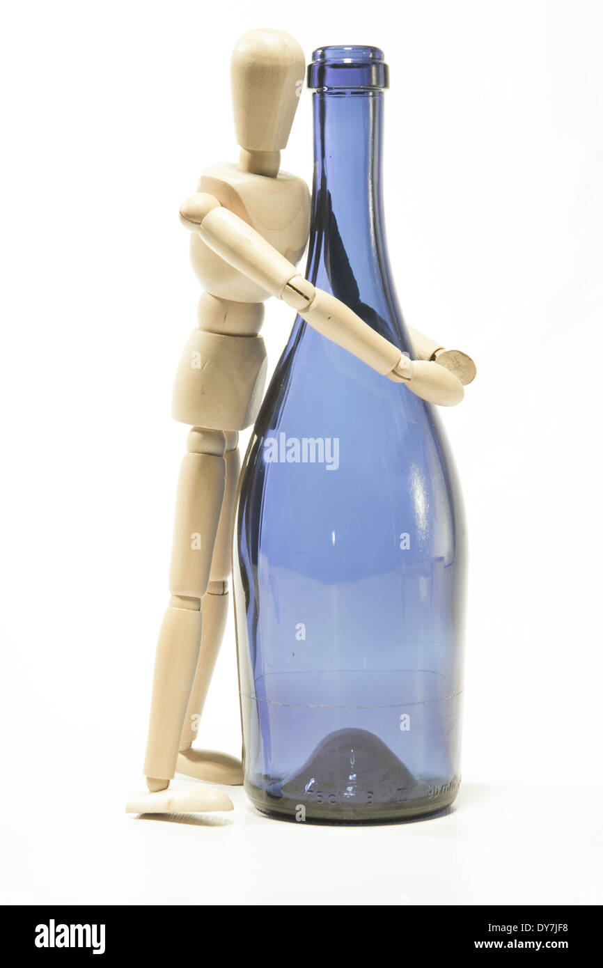 Toy doll hugging bottle of wine Stock Photo - Alamy
