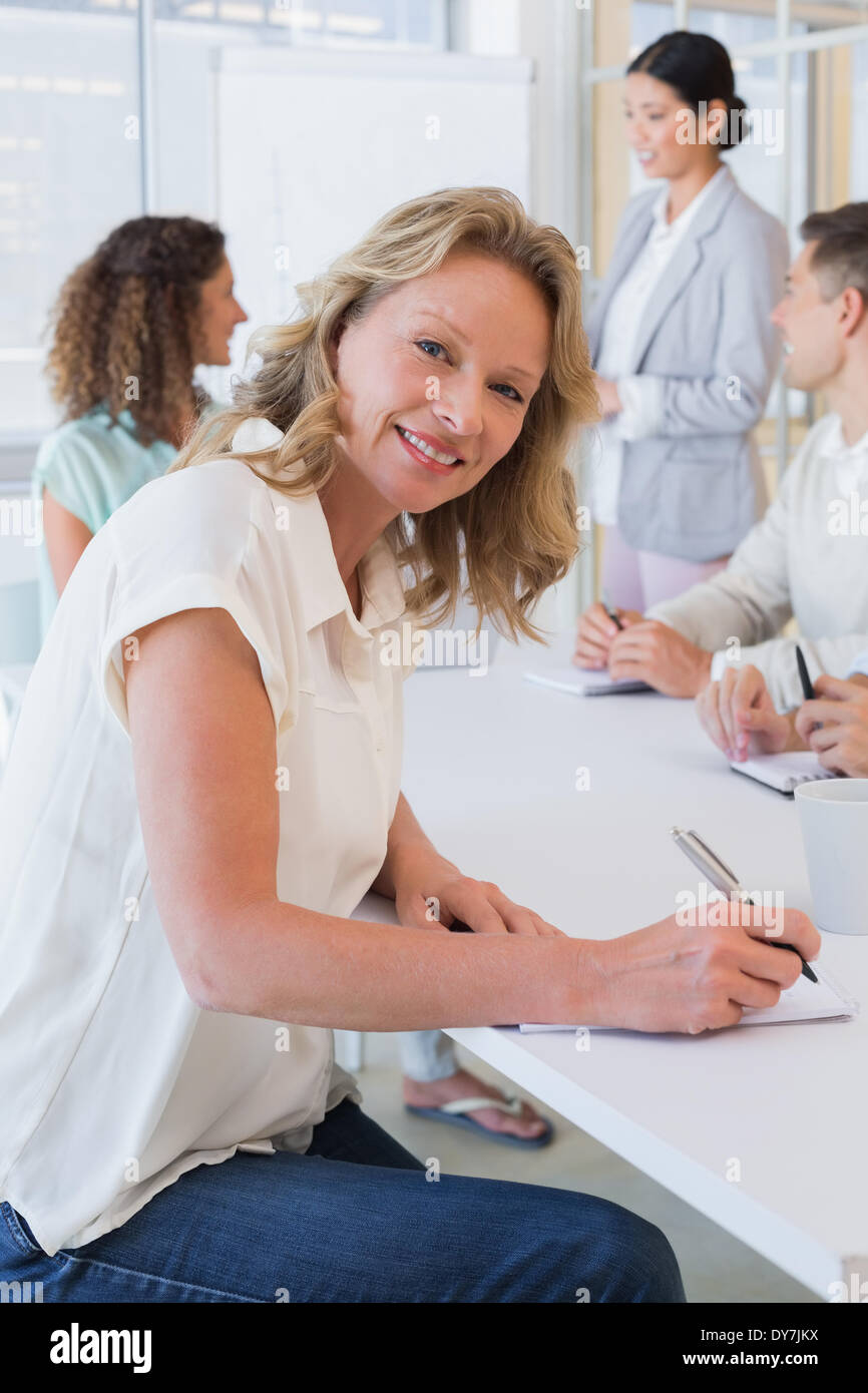 Casual businesswoman taking notes during meeting in the office Stock ...