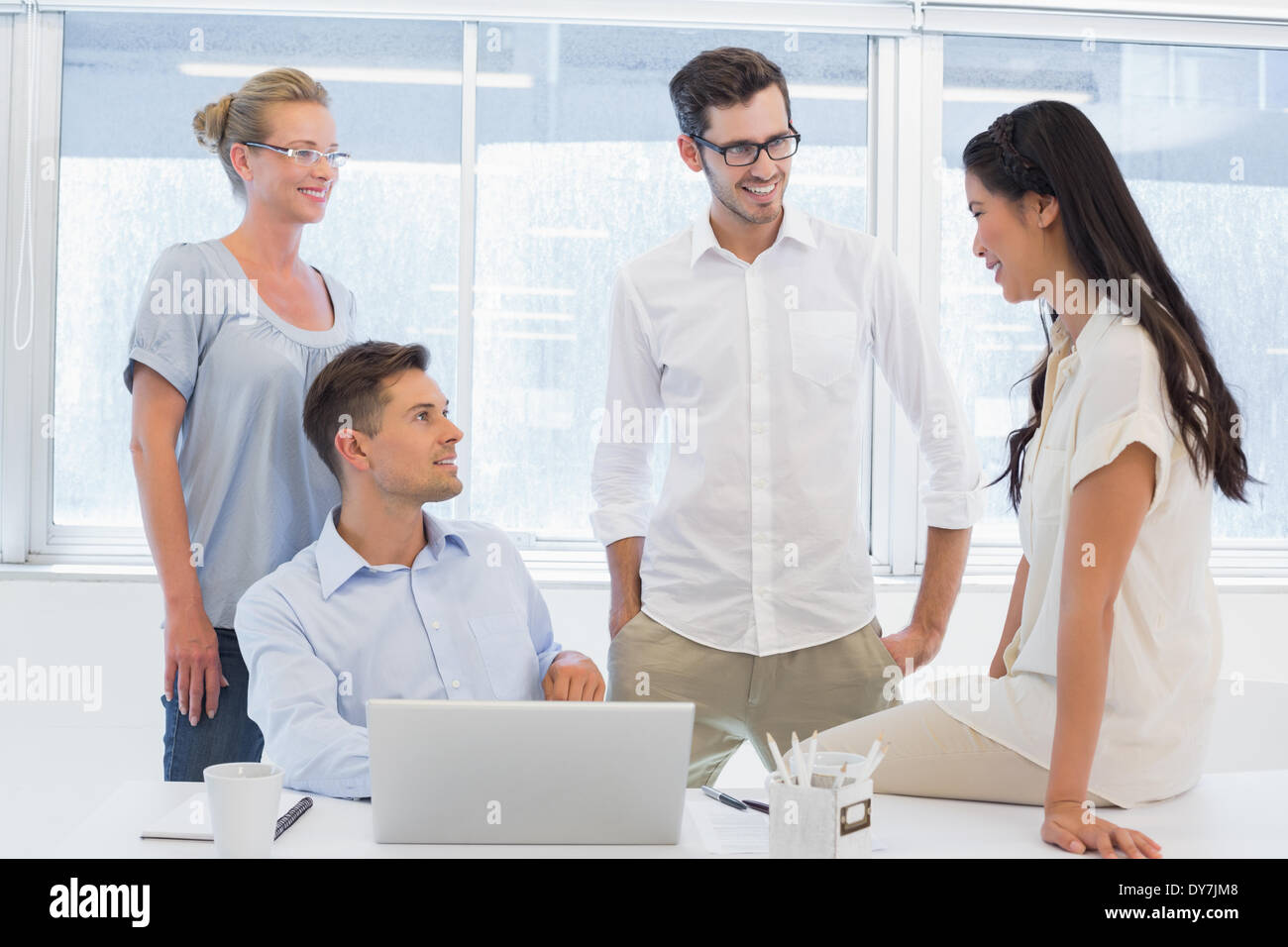 Casual business team chatting together Stock Photo - Alamy