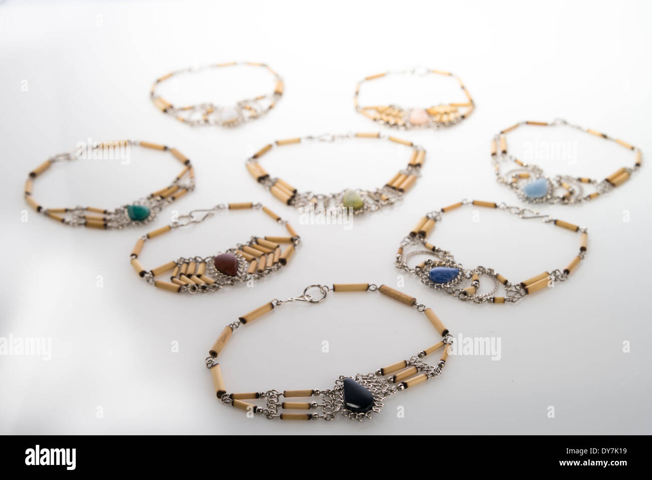 Handcrafted Peruvian beaded bracelet collection on white background ...