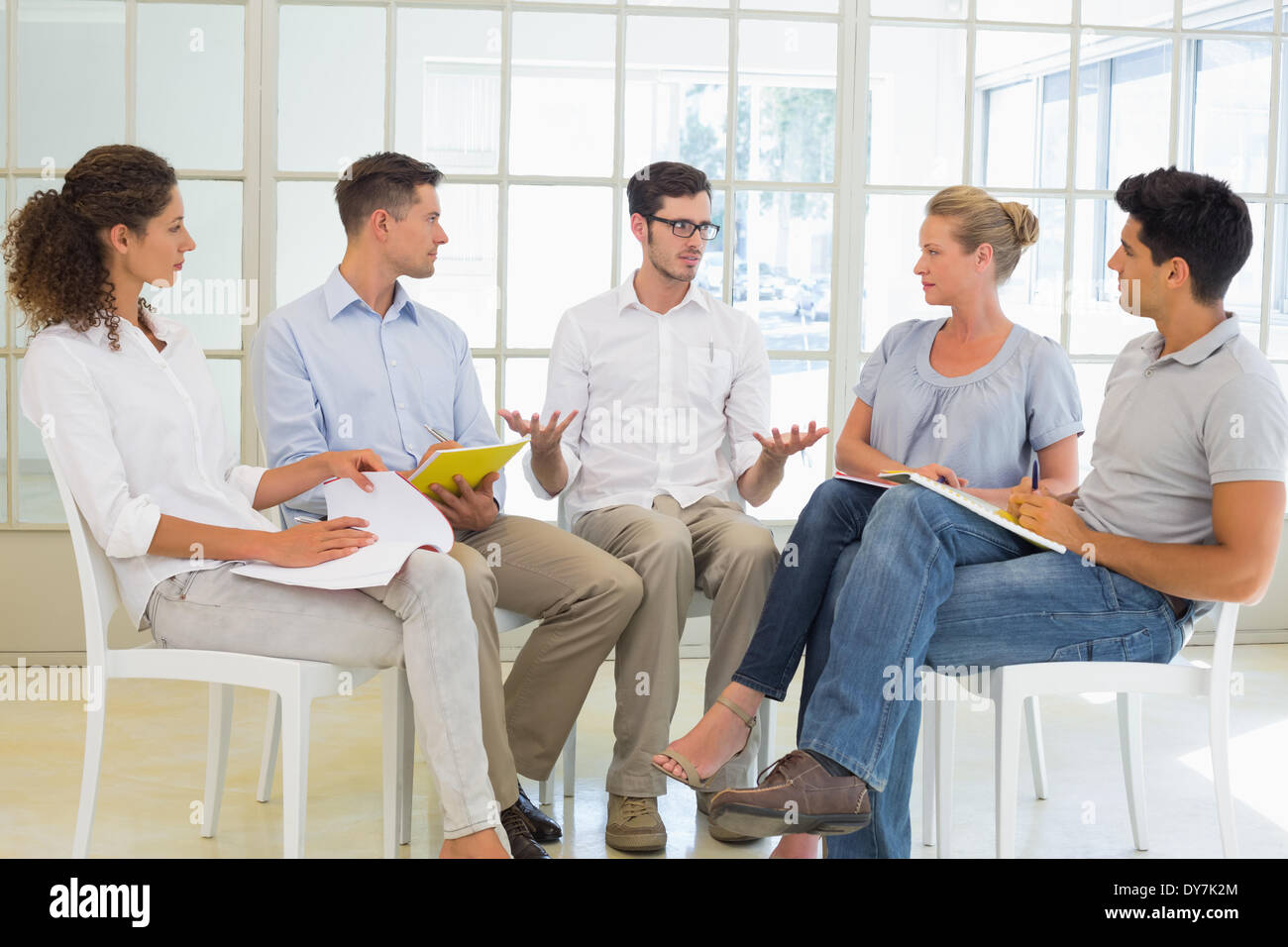 Coworkers talking in a circle hi-res stock photography and images - Alamy